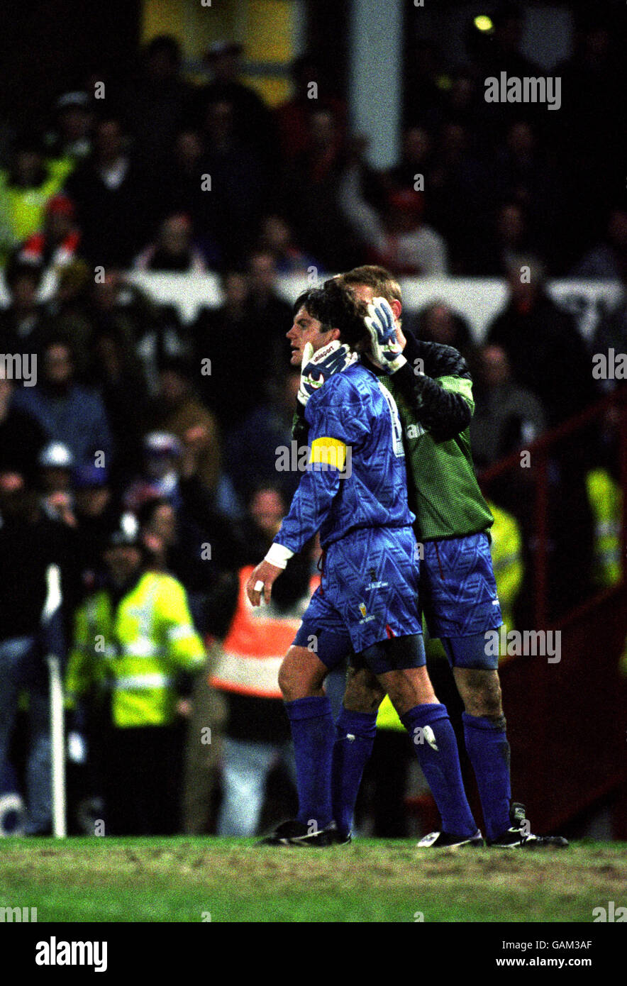 Portsmouth's Martin Kuhl is consoled by goalkeeper Alan Knight after ...