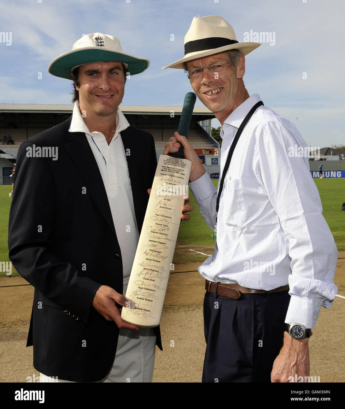 England captain Michael Vaughan presents a special bat to Christopher ...