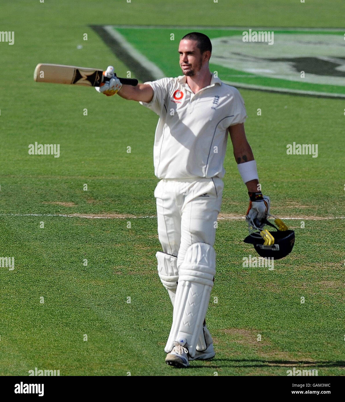 Cricket batsman raising bat hi-res stock photography and images - Alamy