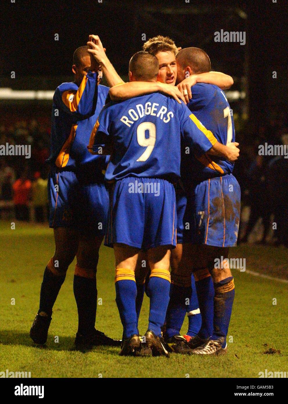 Shrewsbury Town players celebrate their third goal scored by Ryan Lowe ...