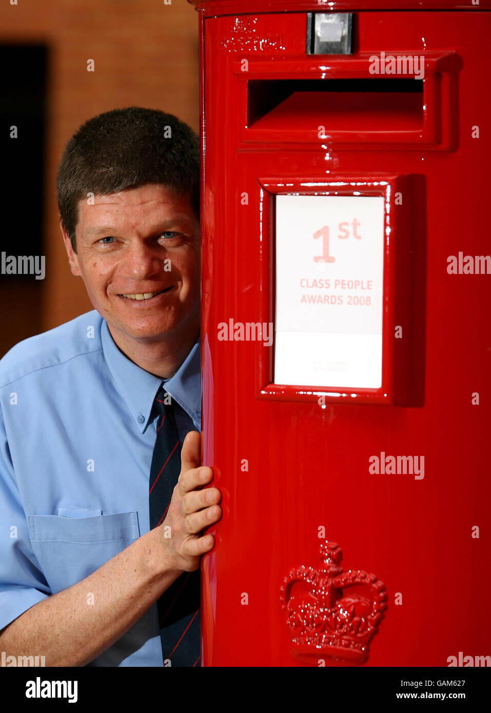 Smiling postman uk hi-res stock photography and images - Alamy