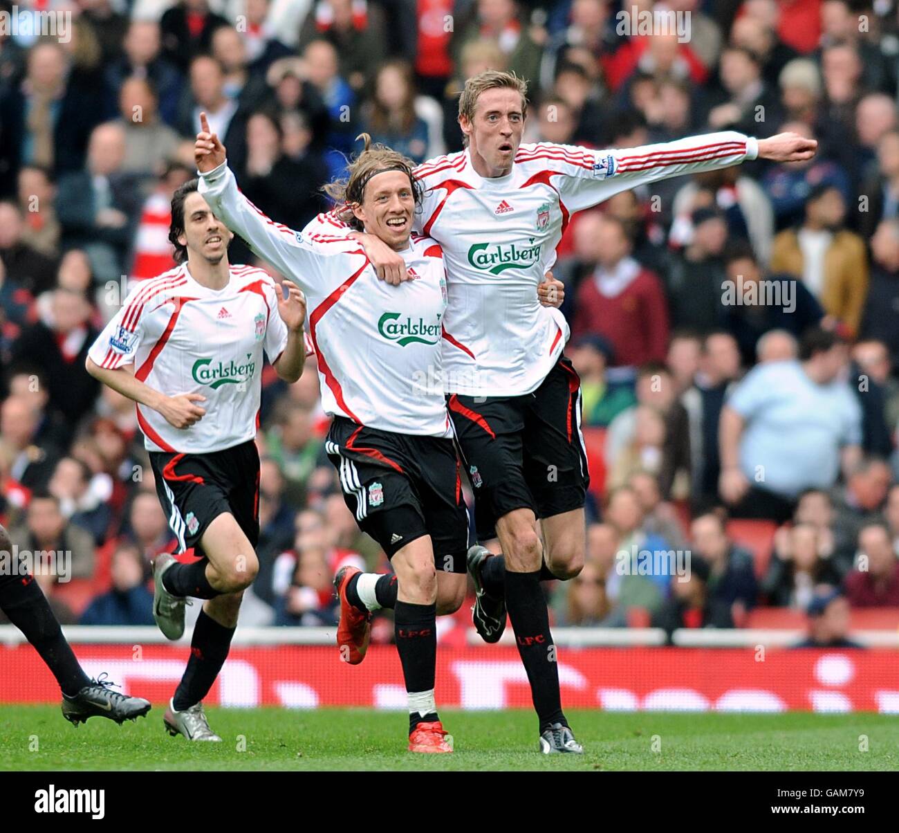 Liverpool's Peter Crouch (right) celebrates scoring the opening goal ...