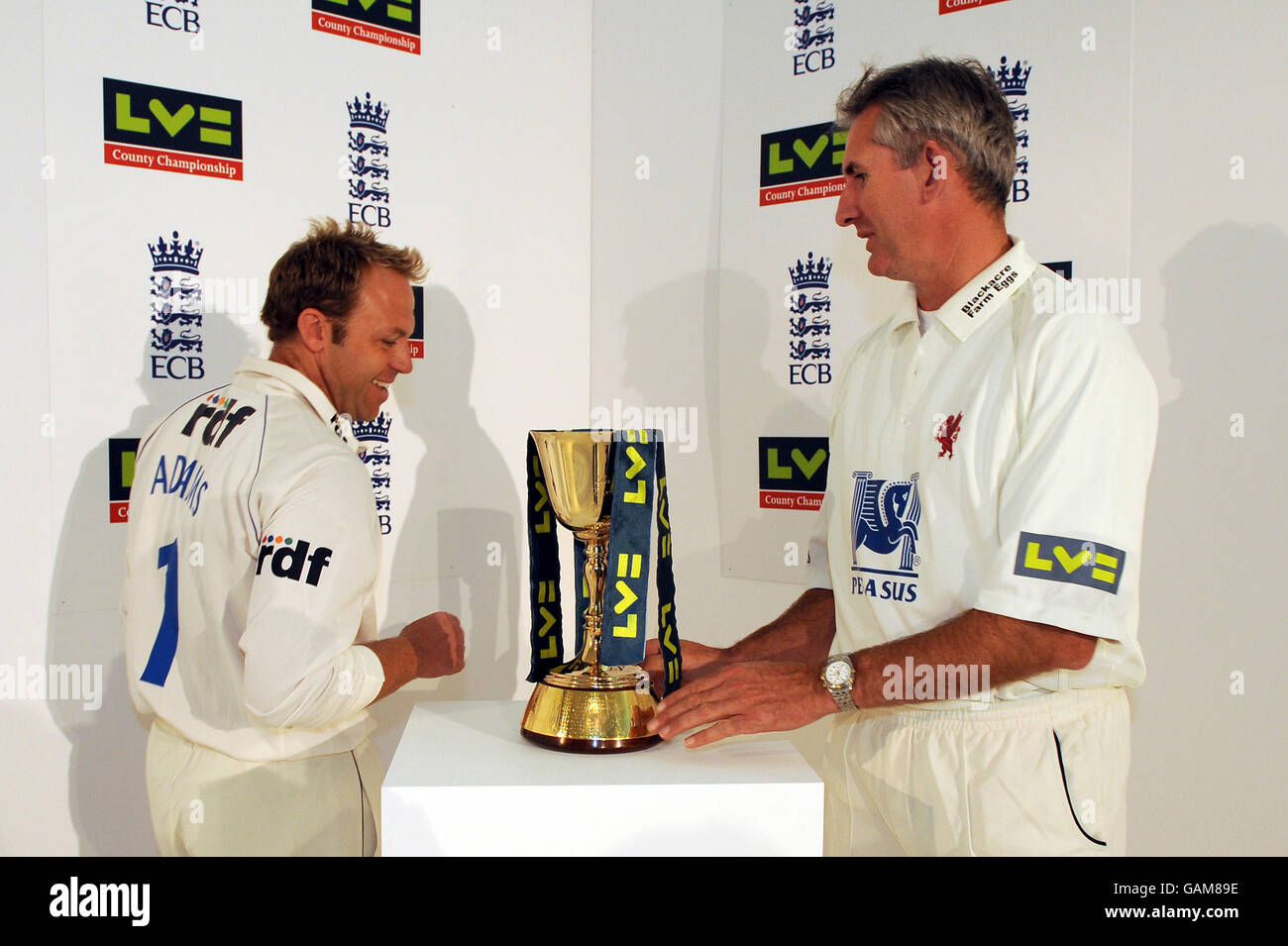 Chris Adams (left) and Andrew Caddick pose with the Liverpool Victoria ...