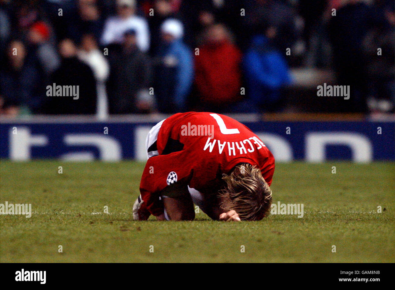 Manchester United's David Beckham goes down holding his ankle Stock ...