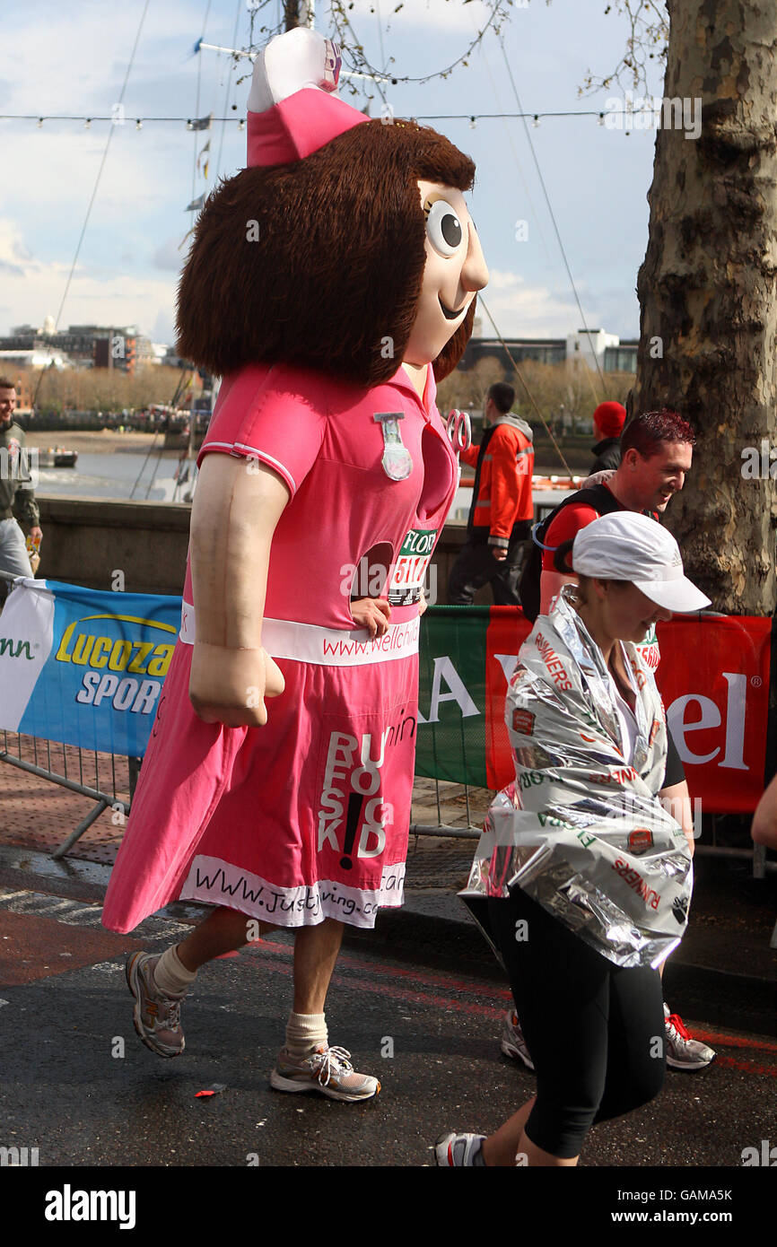 A competitor dressed as a Giant Nurse, during the Flora London Marathon ...