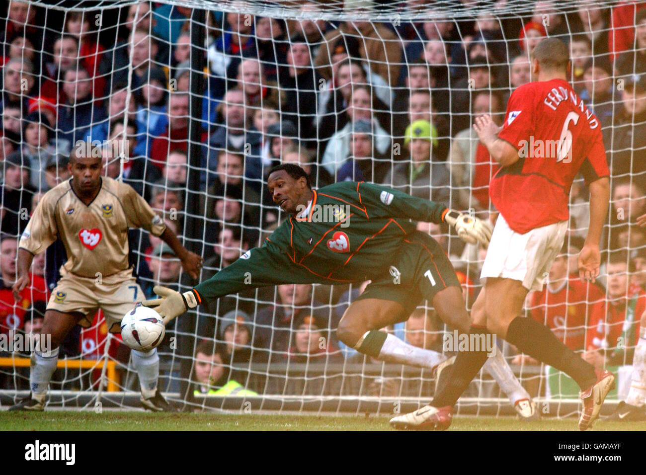 Portsmouth goalkeeper Shaka Hislop makes a fine save from Manchester ...