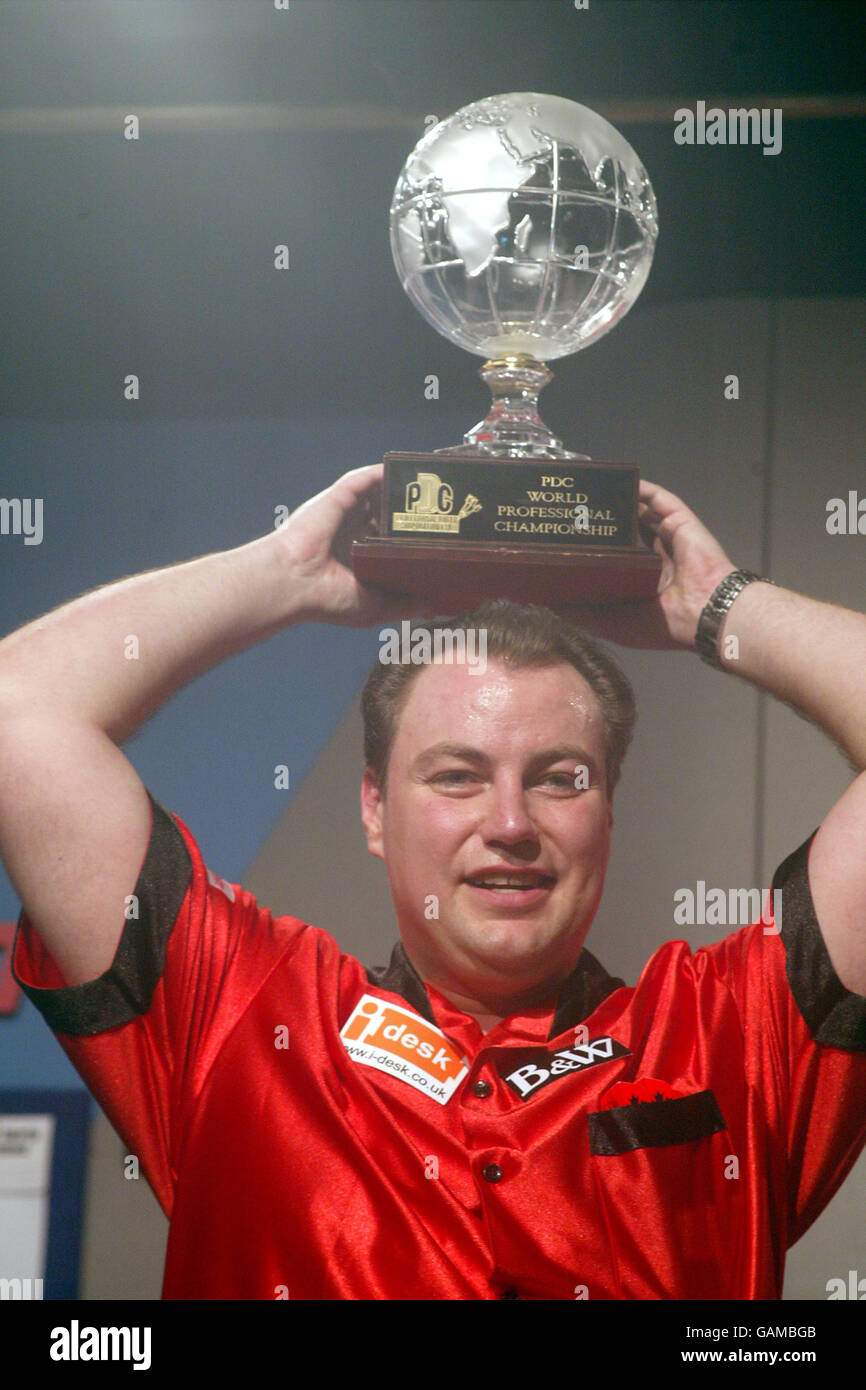 Phil taylor celebrates with the trophy hi-res stock photography and ...