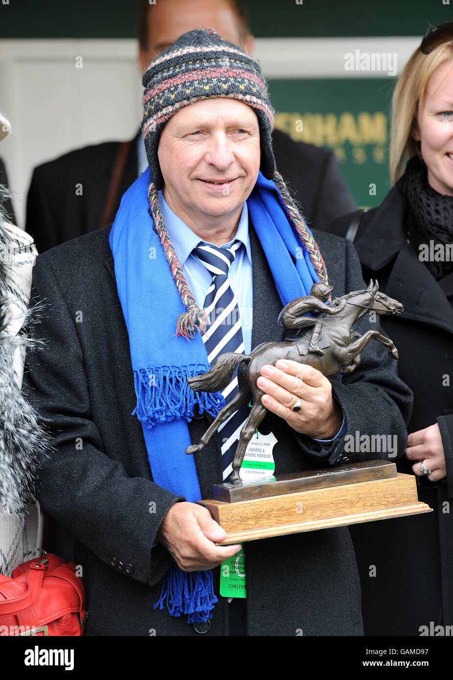 Owner Brendan Richardson celebrates with the trophy after winning with ...
