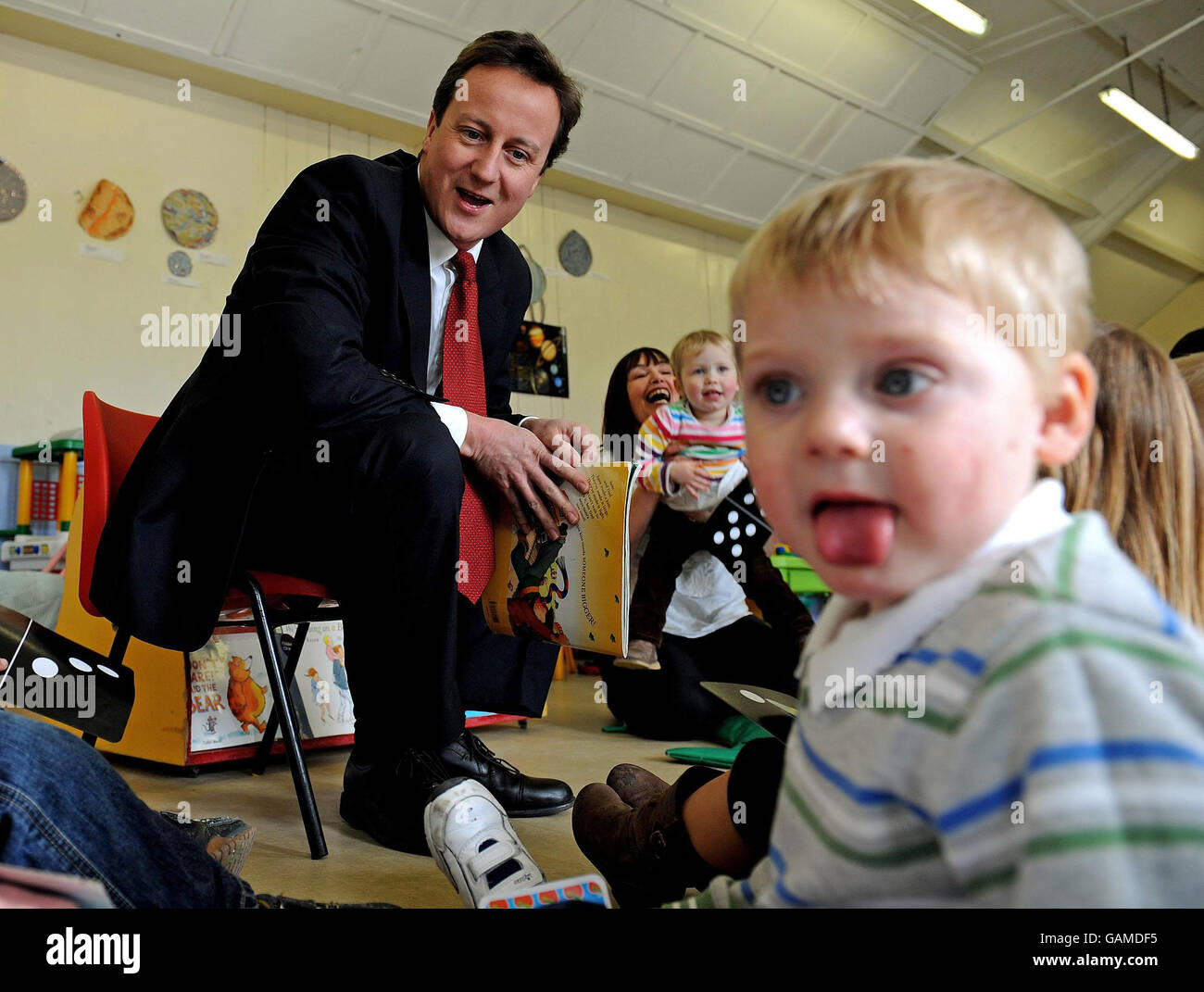 Conservative Leader David Cameron reads a story to children at the ...