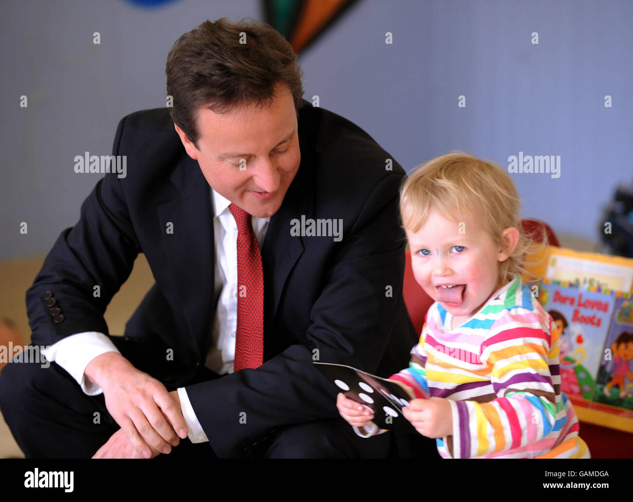 Conservative Leader David Cameron reads a story to children at the ...