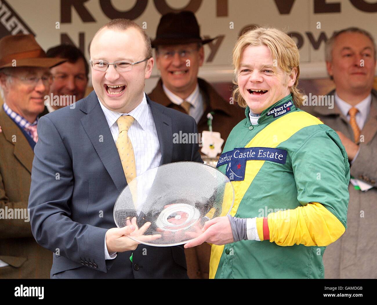Jockey Robert Thornton celebrates with the trophy after winning on ...