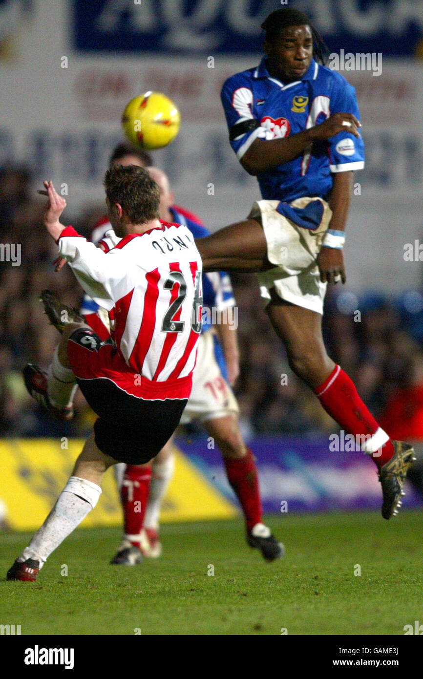 Portsmouth's Vincent Pericard (r) and Sheffield United's Wayne Quinn (l ...