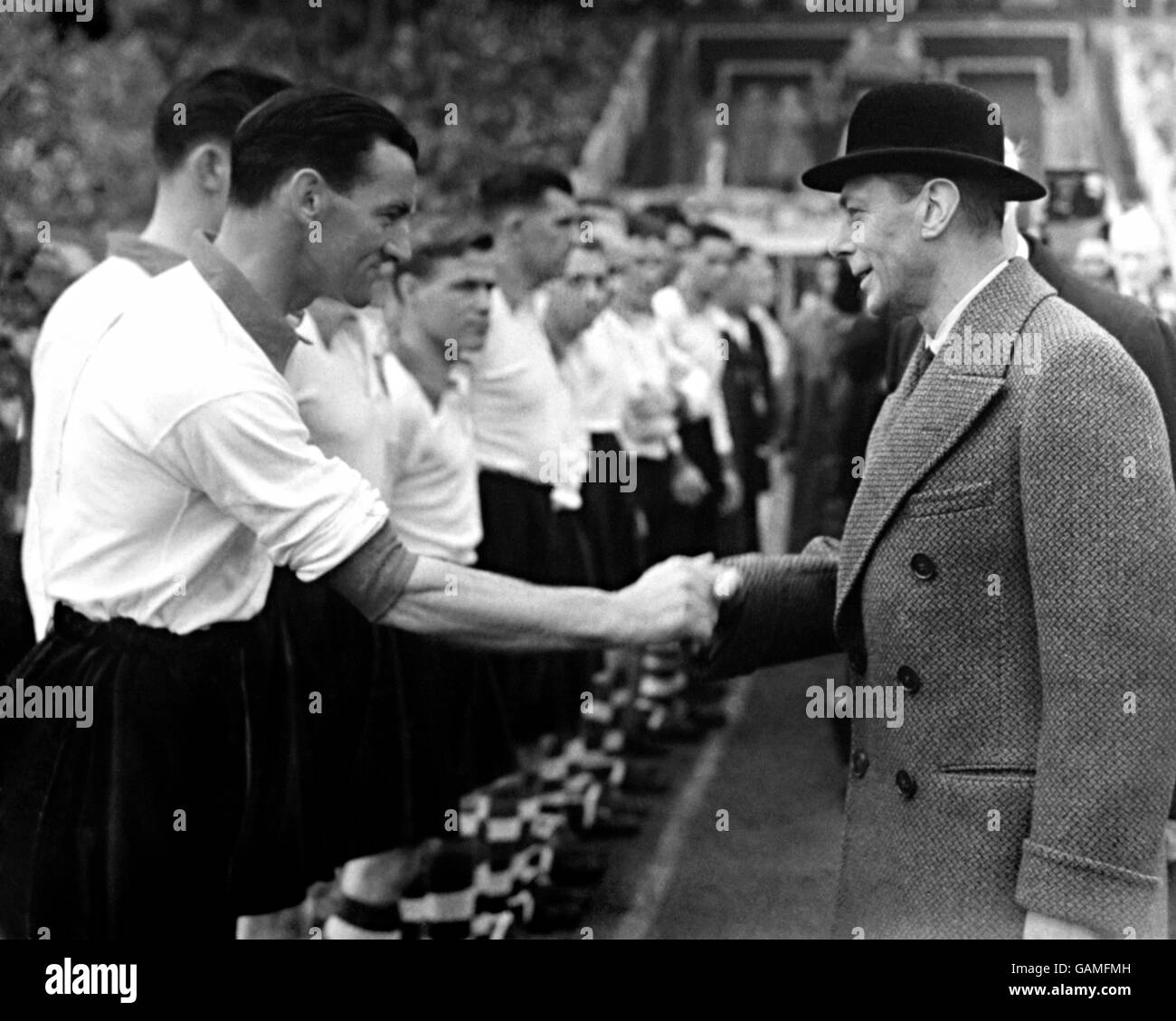 (L-R) Liverpool captain Phil Taylor shakes hands with HRH King George ...