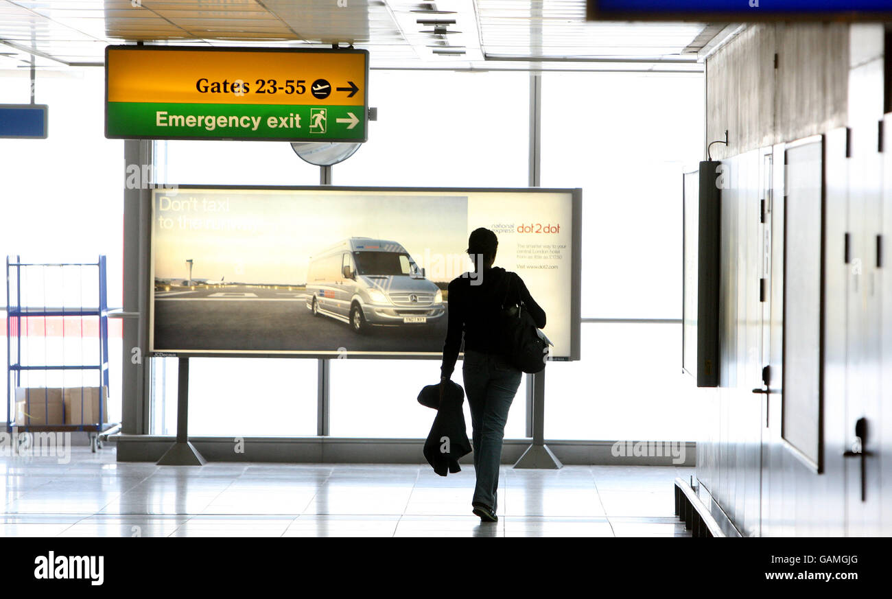 Generic picture of a passenger walking between departure gates in ...