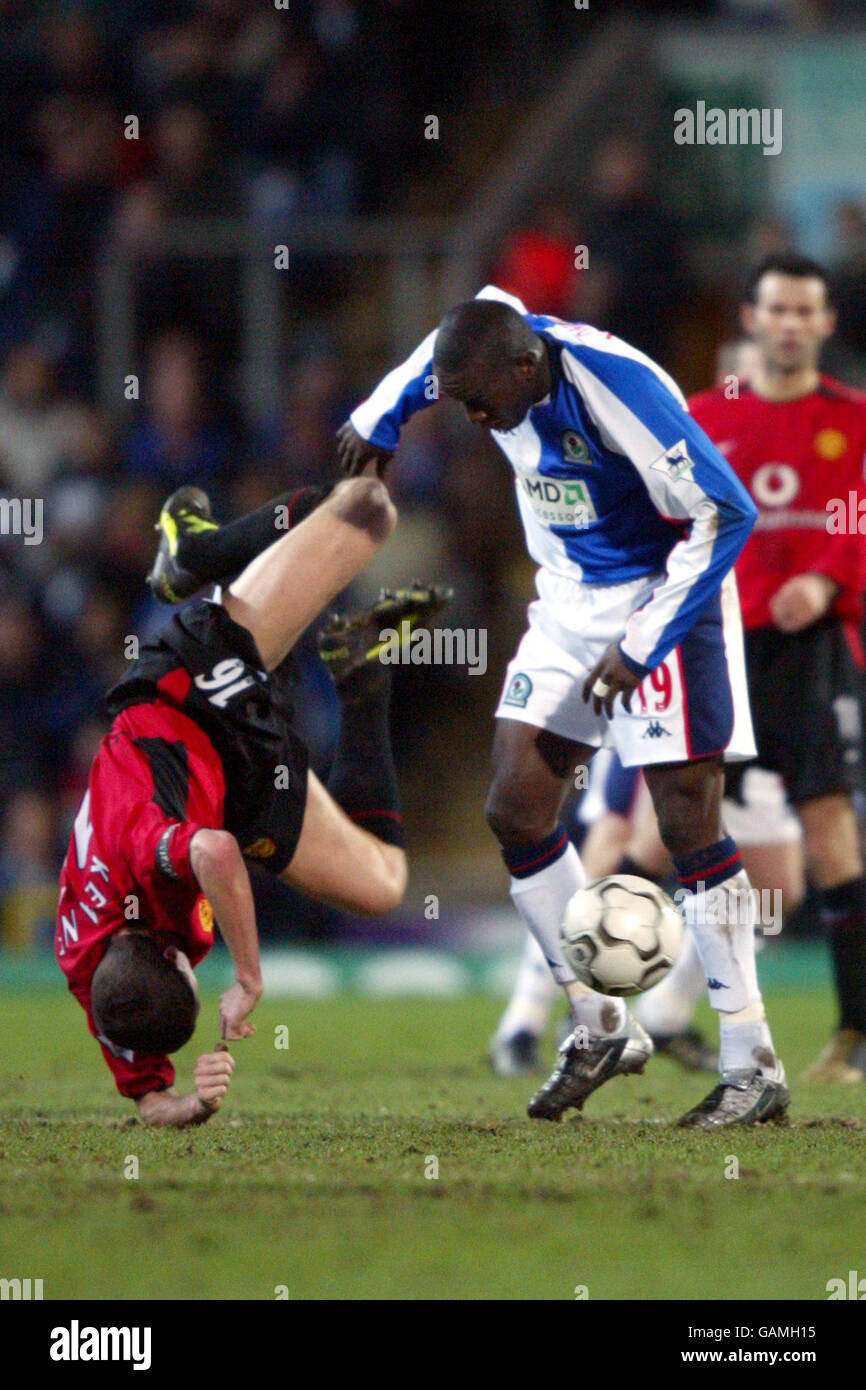 Manchester United's Roy Keane (l) goes over the top off Blackburn ...