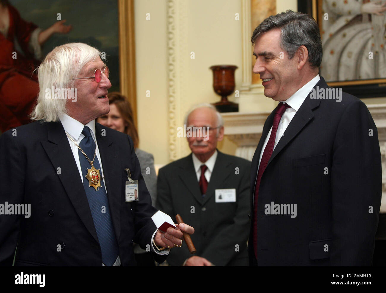 Sir Jimmy Savile after he received a commemorative badge from Prime ...