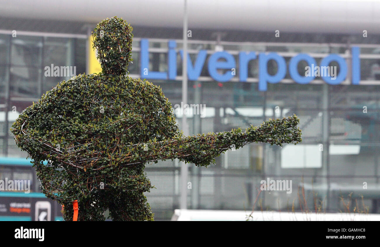 Topiary figures in the shape of the Beatles outside Liverpool South ...