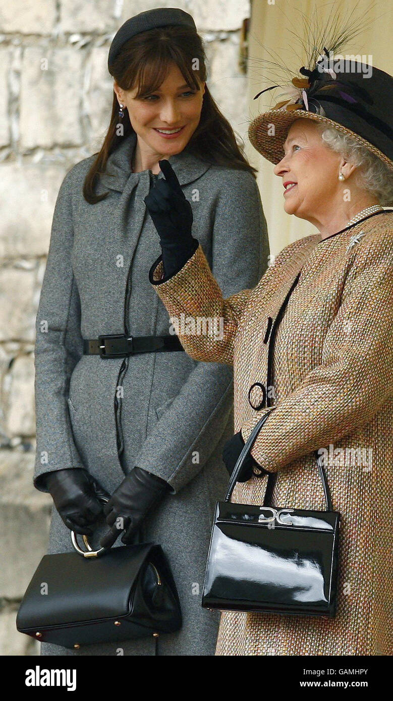 French first lady Carla Bruni and Queen Elizabeth II watch the Guard of ...
