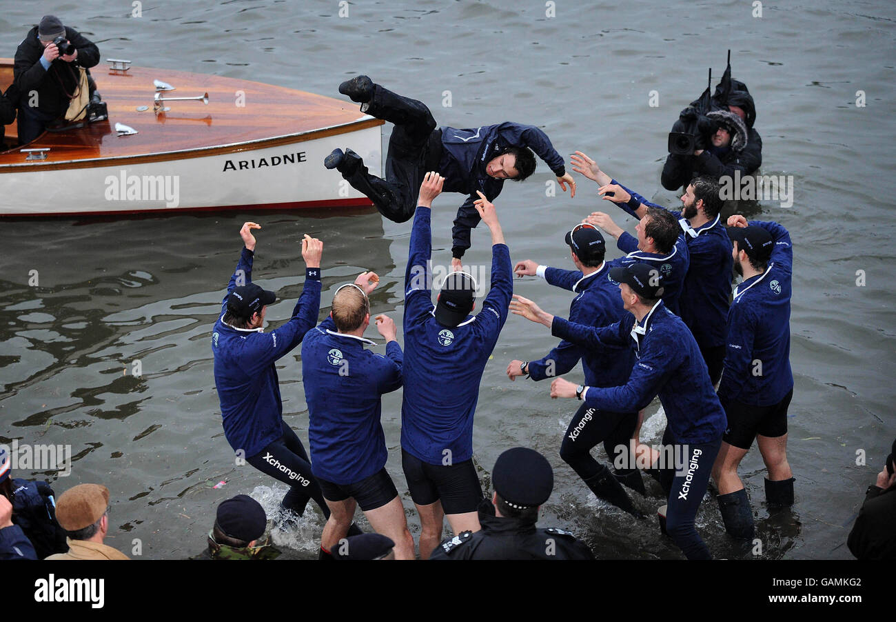The Oxford University boat team celebrate winning the Race, by throwing ...