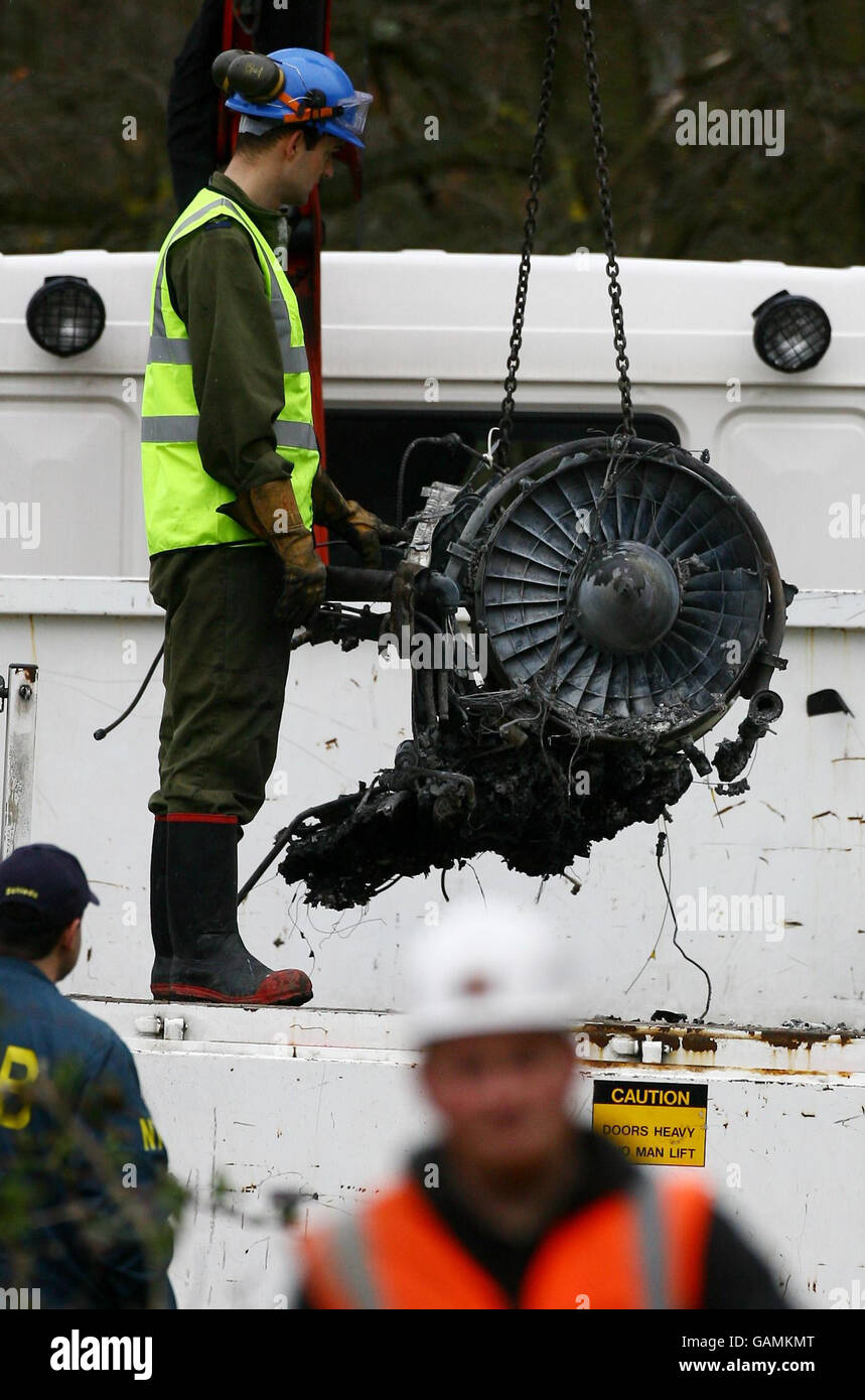 Workers recover parts of the plane from plane crash site in Romsey ...