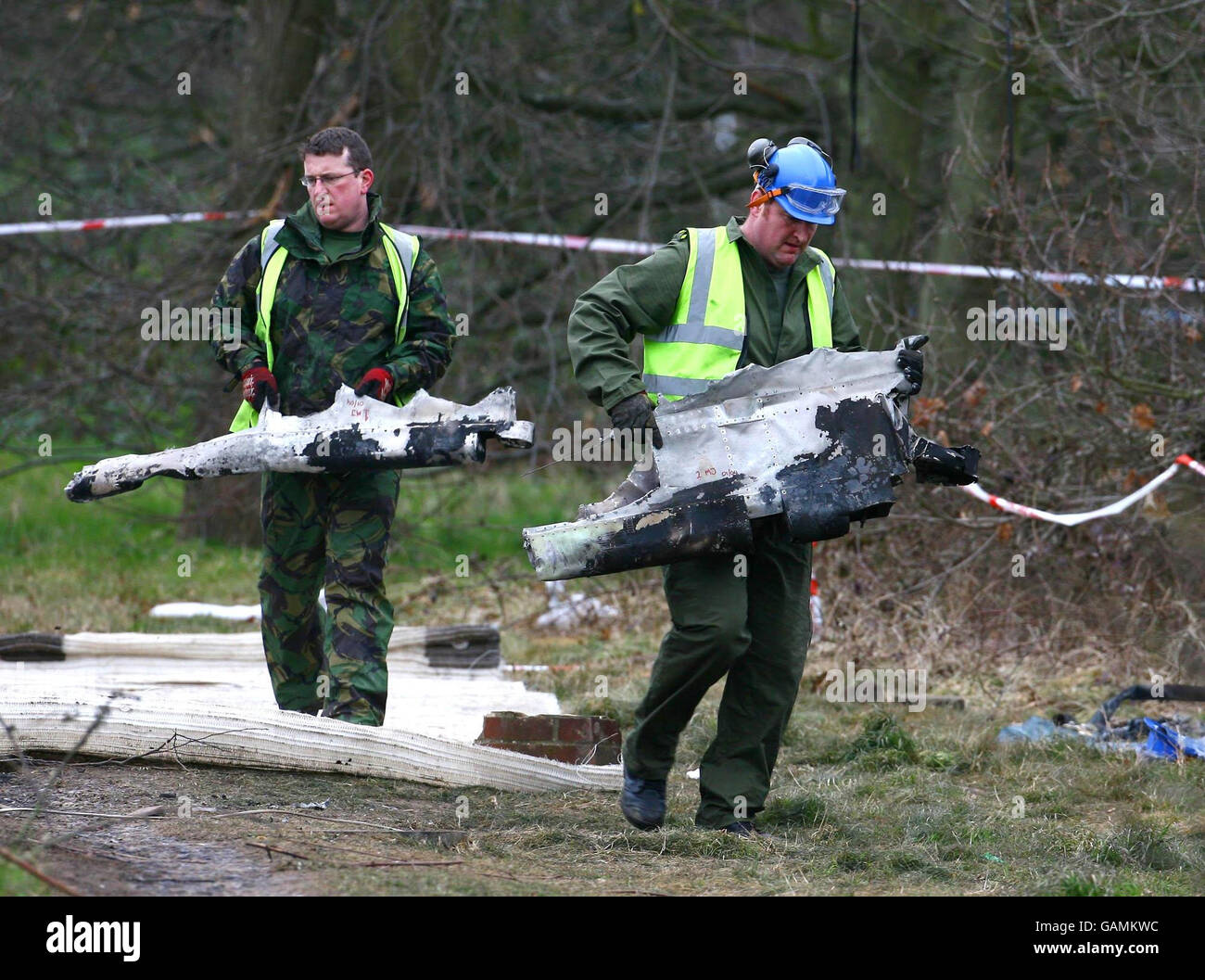 Workers recover parts of the plane from plane crash site in Romsey ...