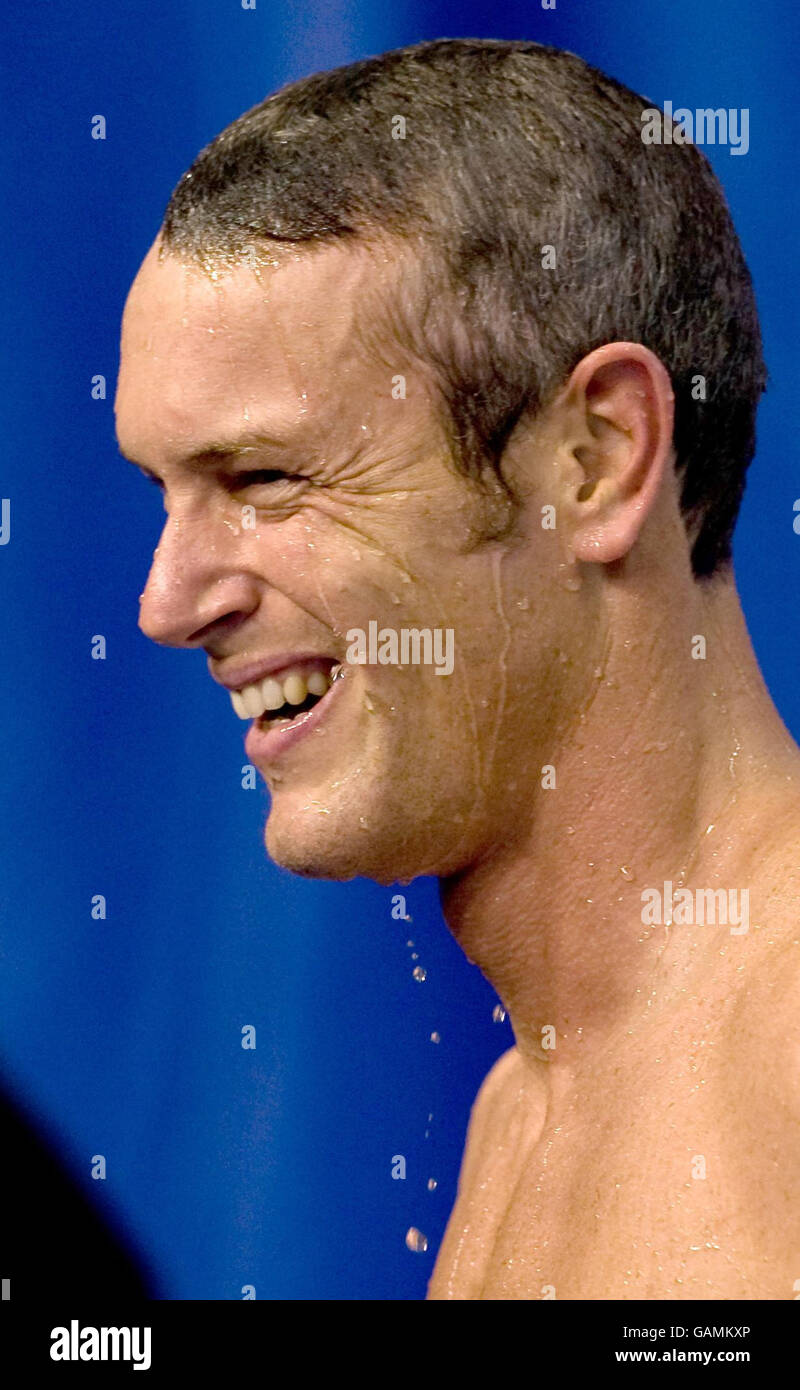 Mark Foster smiles after finishing first in the Men's 50 metres ...