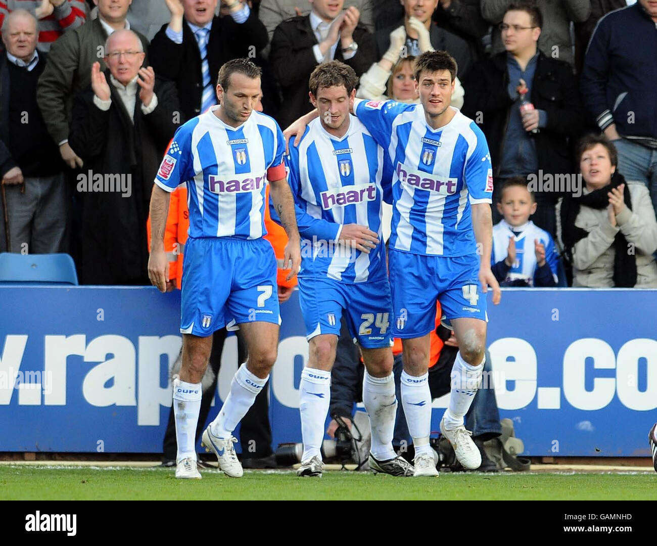 Colchester United's Scott Vernon (centre) celebrates his second goal ...