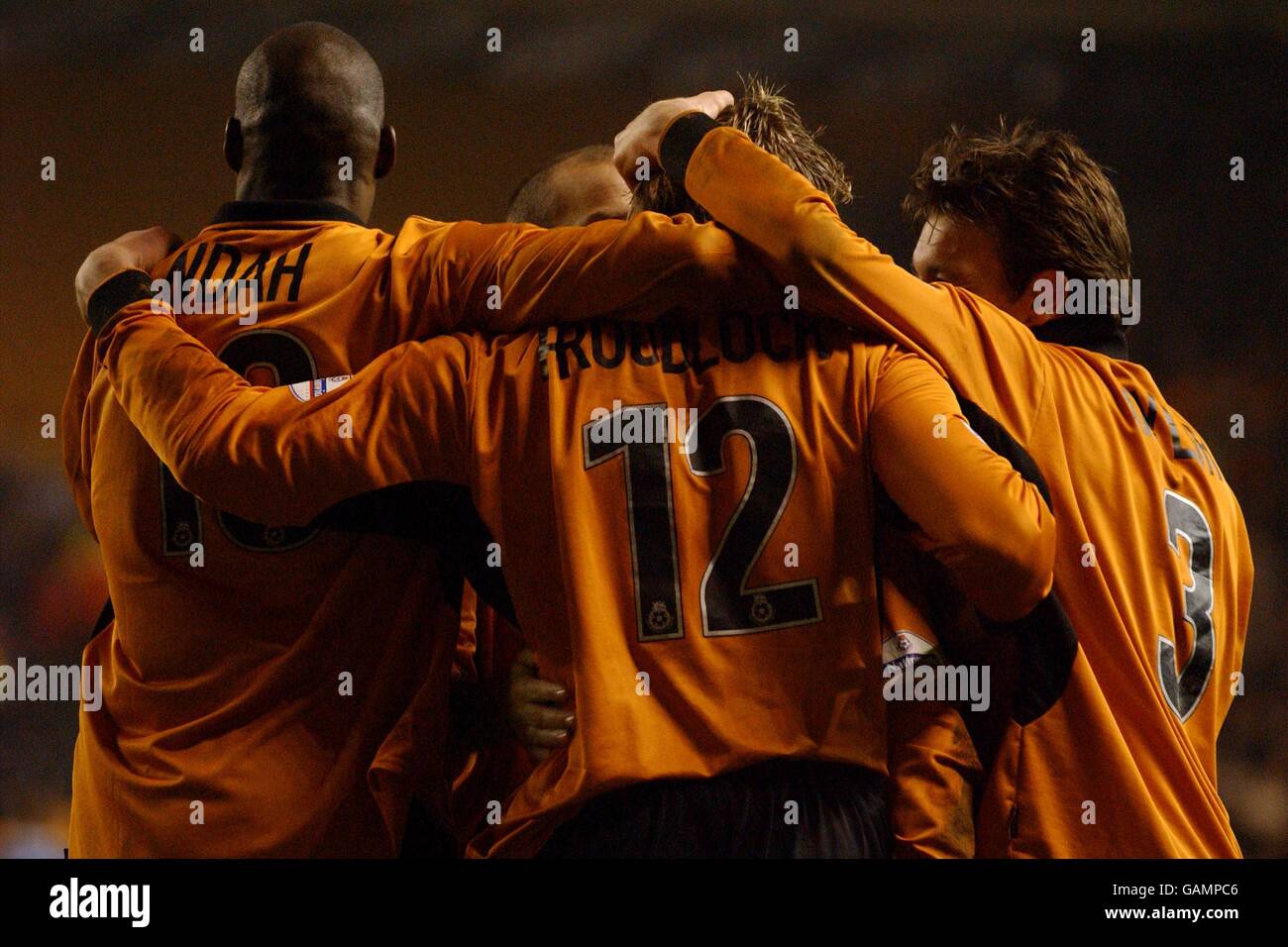 Wolves players congratulate Adam Proudlock after he scored the third ...