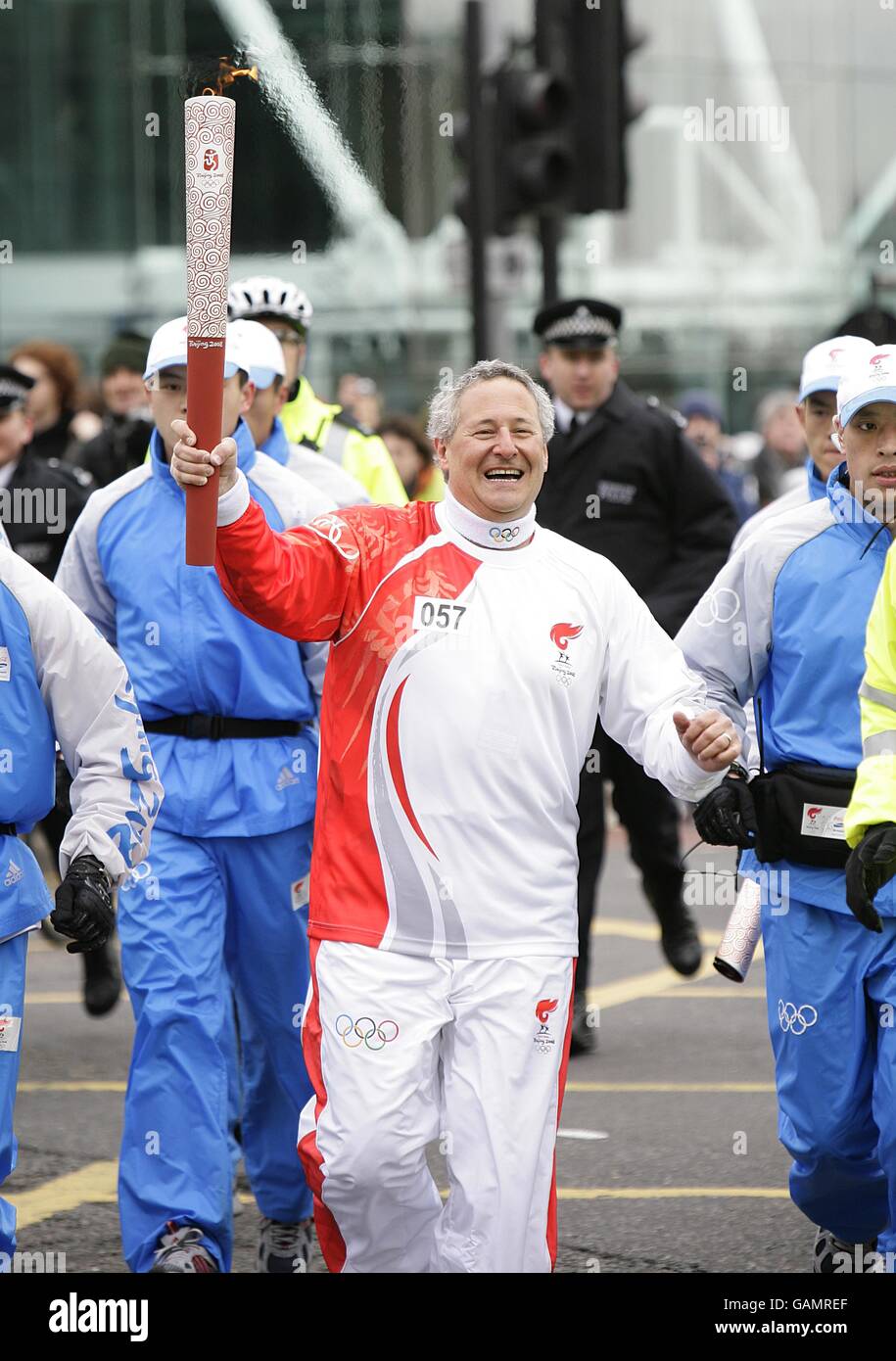 The torch leaves Tower Bridge during the Beijing Olympics torch relay ...