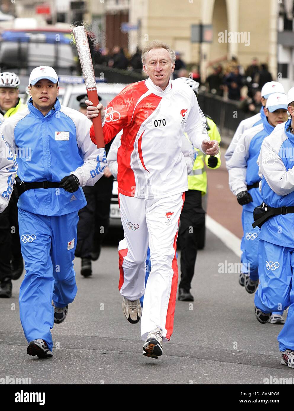 Beijing Olympics Torch Relay - London. David Hemery carries the torch ...
