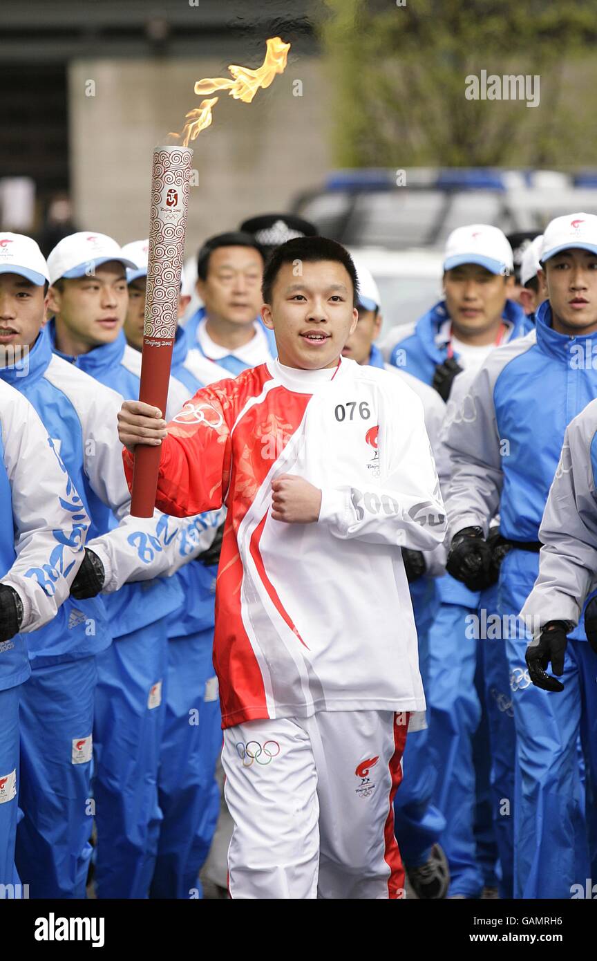 Beijing Olympics Torch Relay - London. The torch is carried near Cabot ...
