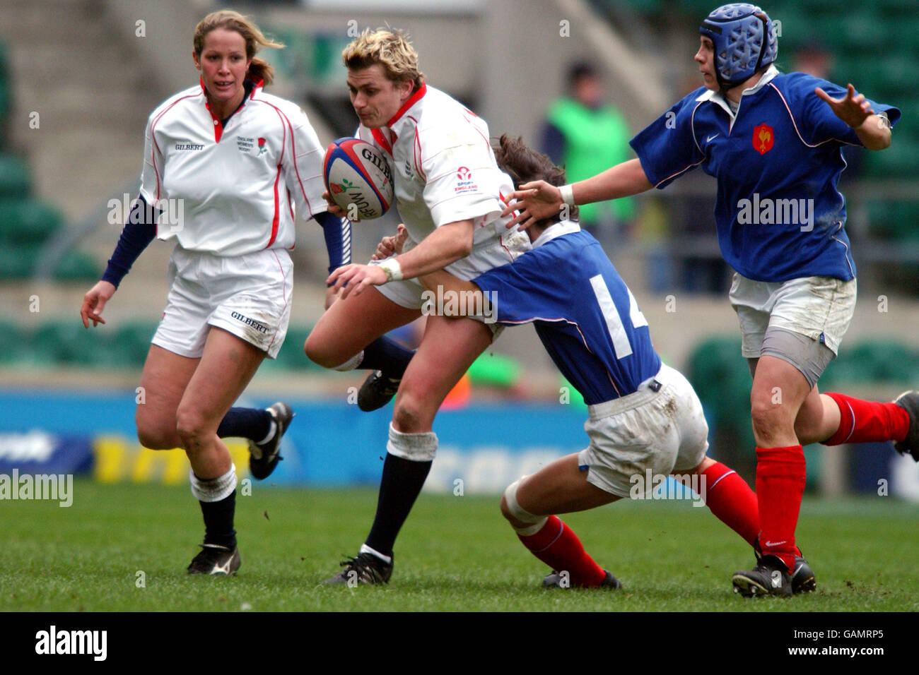 England's Chris Diver avoids the challenge of France's Catherine ...