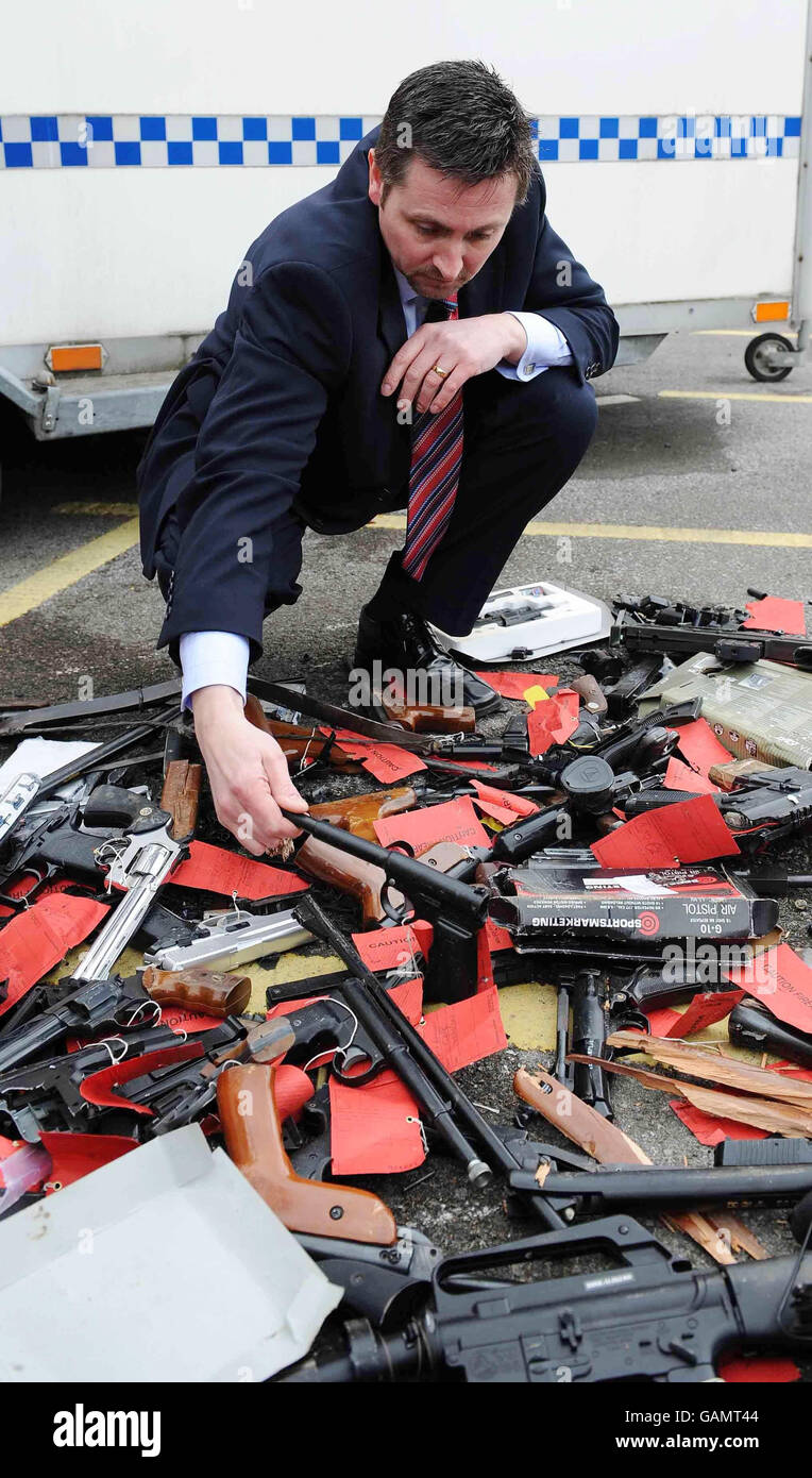 Imitation firearms crushed Stock Photo - Alamy