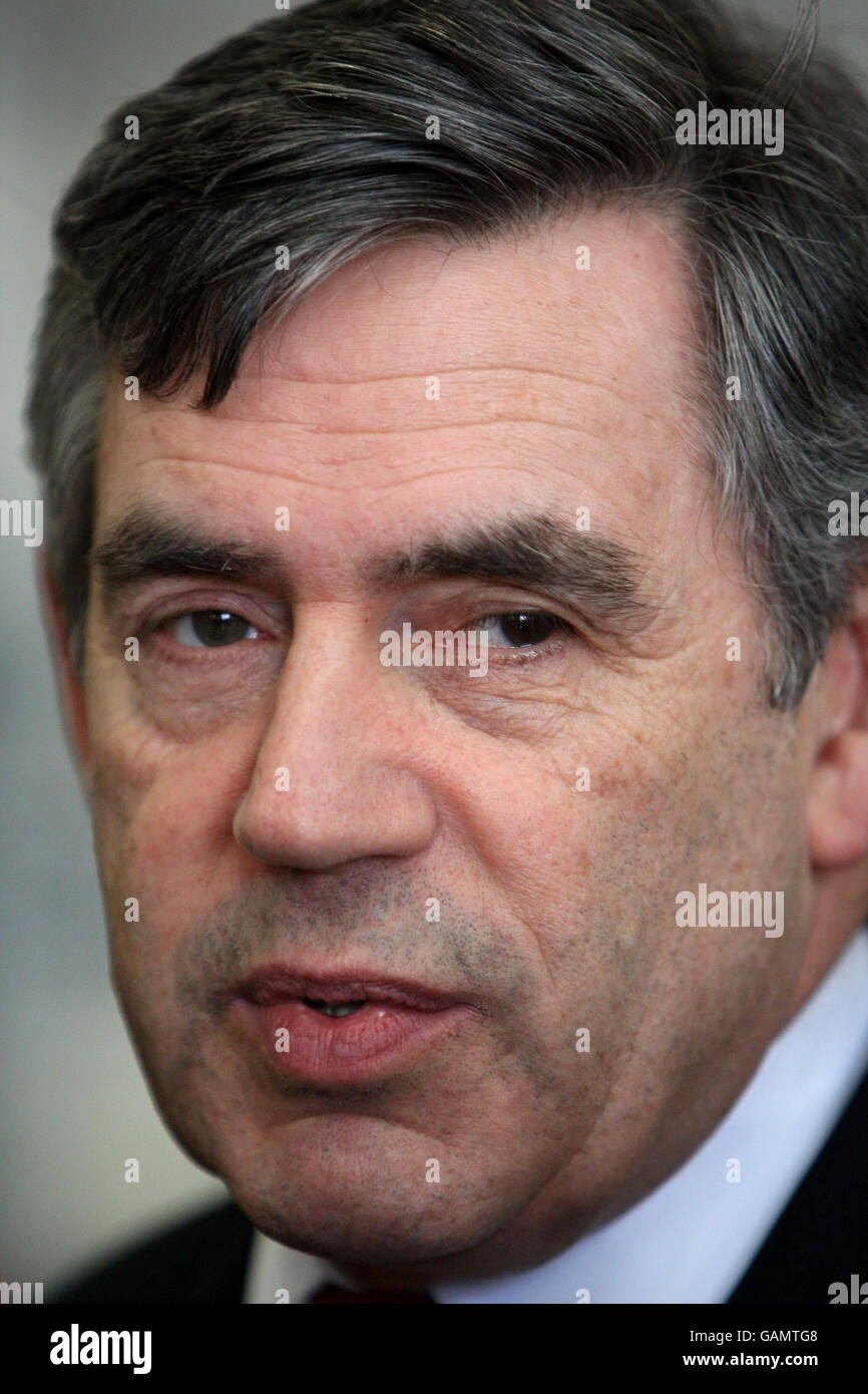Britain's Prime Minister Gordon Brown (centre) meets bus drivers and ...