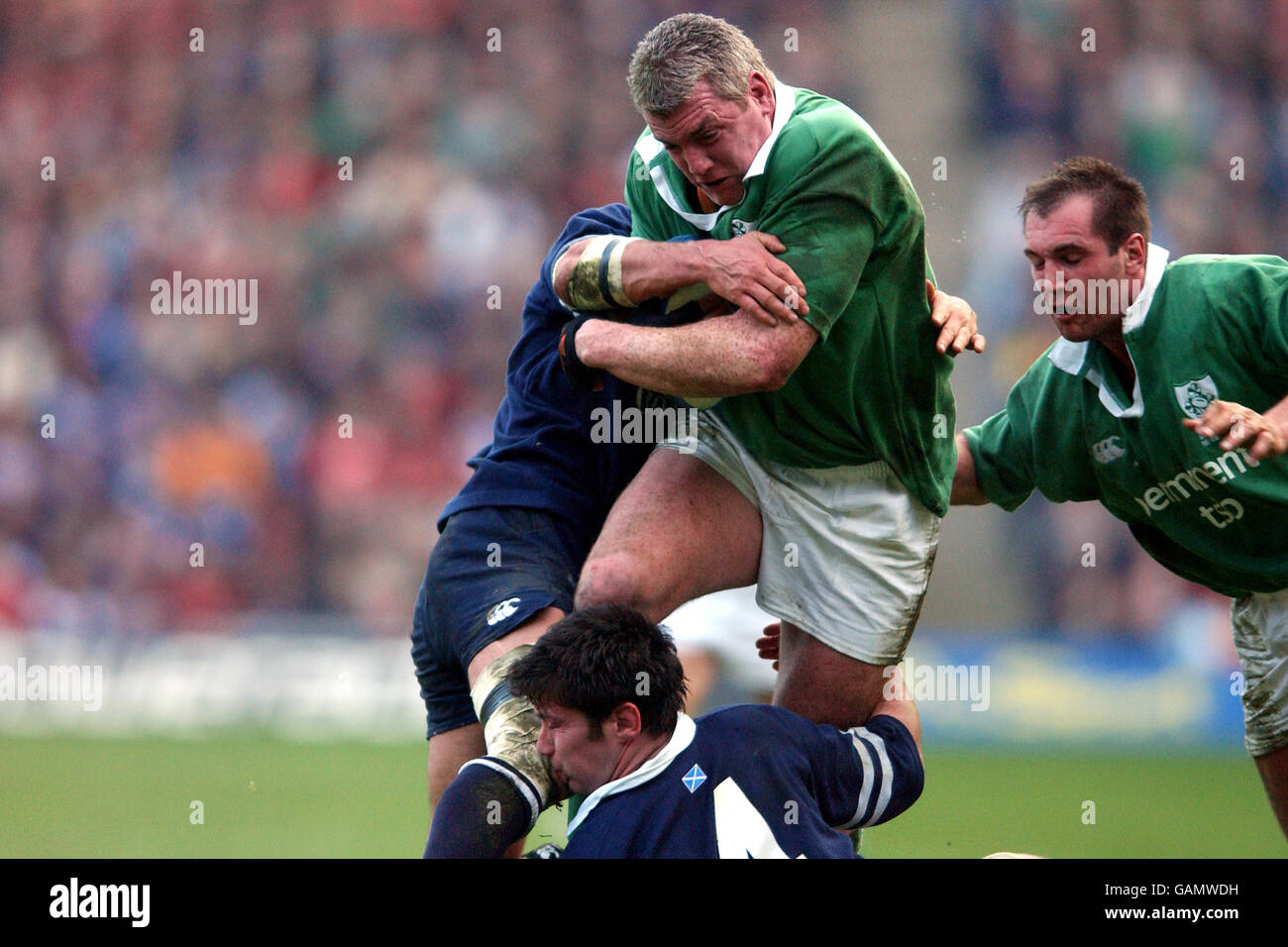 Ireland's Victor Costellois (top) tackled by Scotland's Scott Murray ...