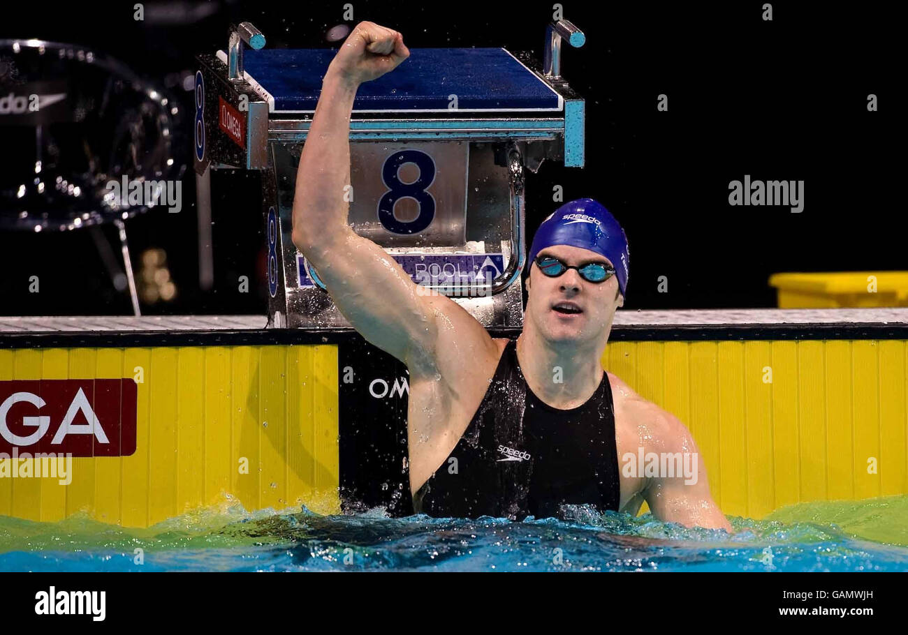 Great Britain's Liam Tancock celebrates winning gold in the 100 metres ...
