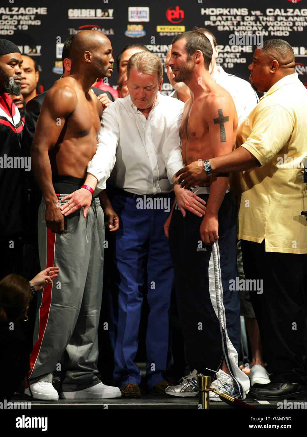 Promoter Frank Warren steps between Britain's World Champion boxer Joe ...