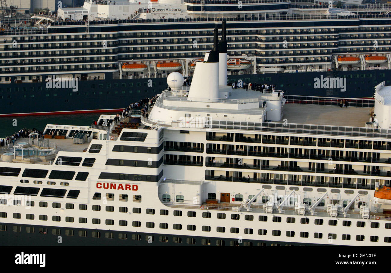 Cunard's Queen Mary II (nearest camera) steams past the Queen Victoria ...