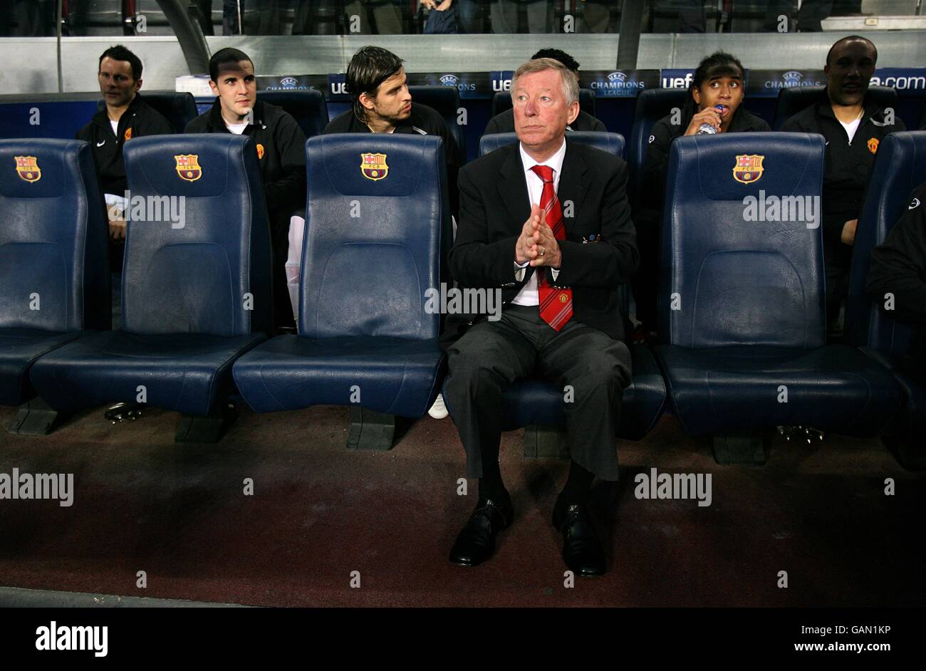 Manchester united manager alex ferguson on the bench hi-res stock ...