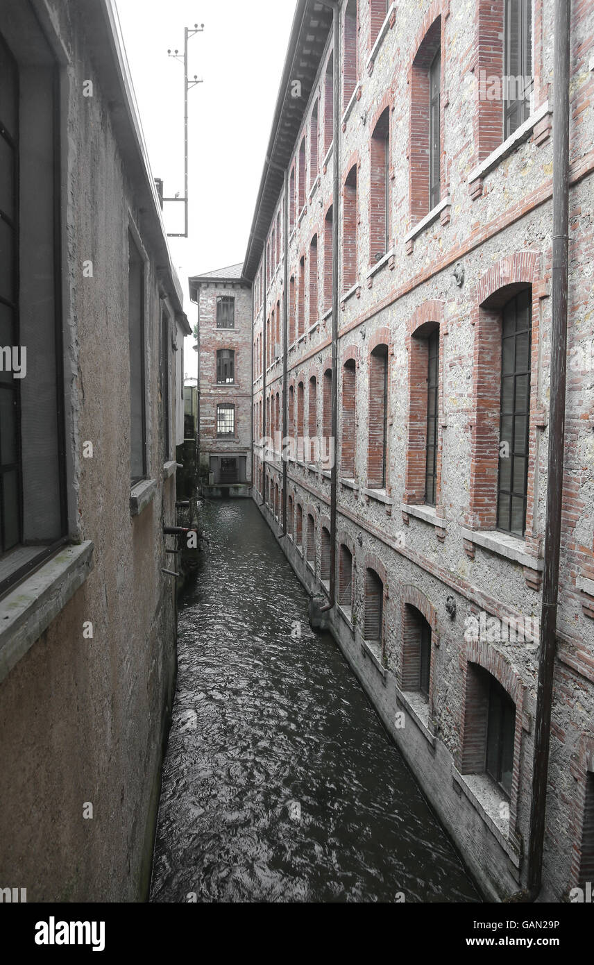 stream with water flowing in the middle of the industrial abandoned ...
