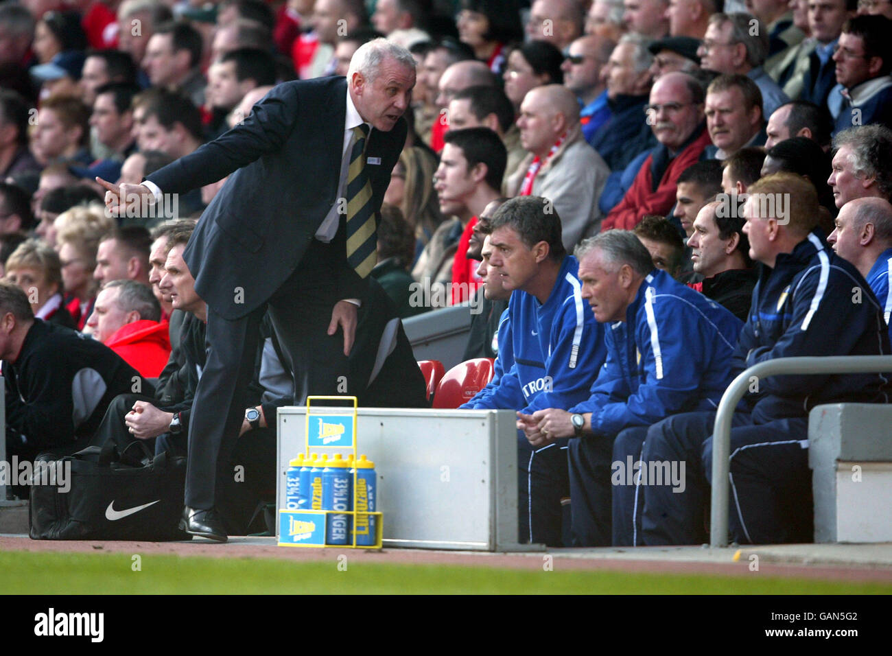 Leeds United's manager Peter Reid has words with his coaching staff ...