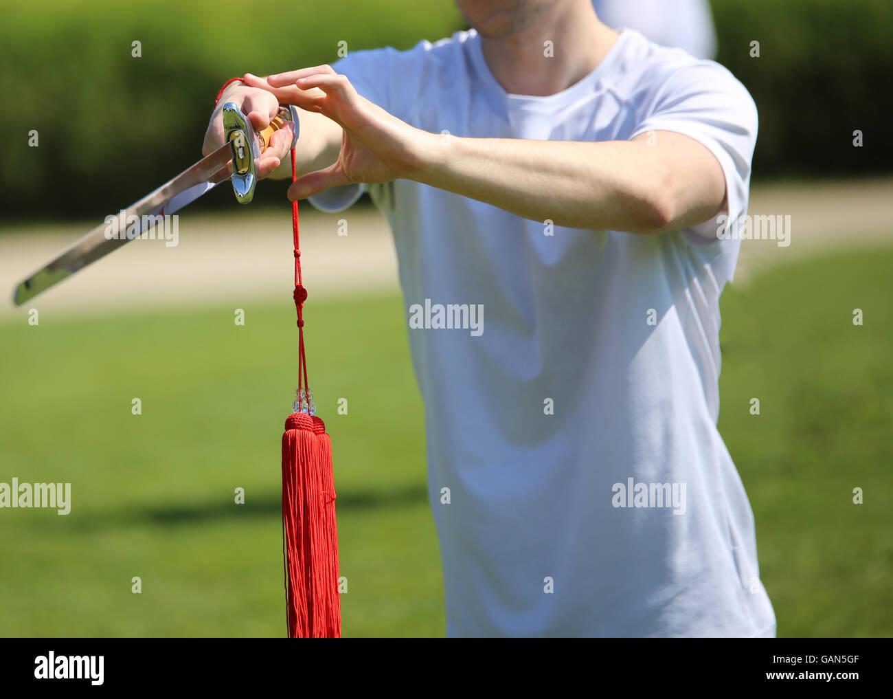 hand of the master of martial arts Tai Chi with the big sharp sword ...