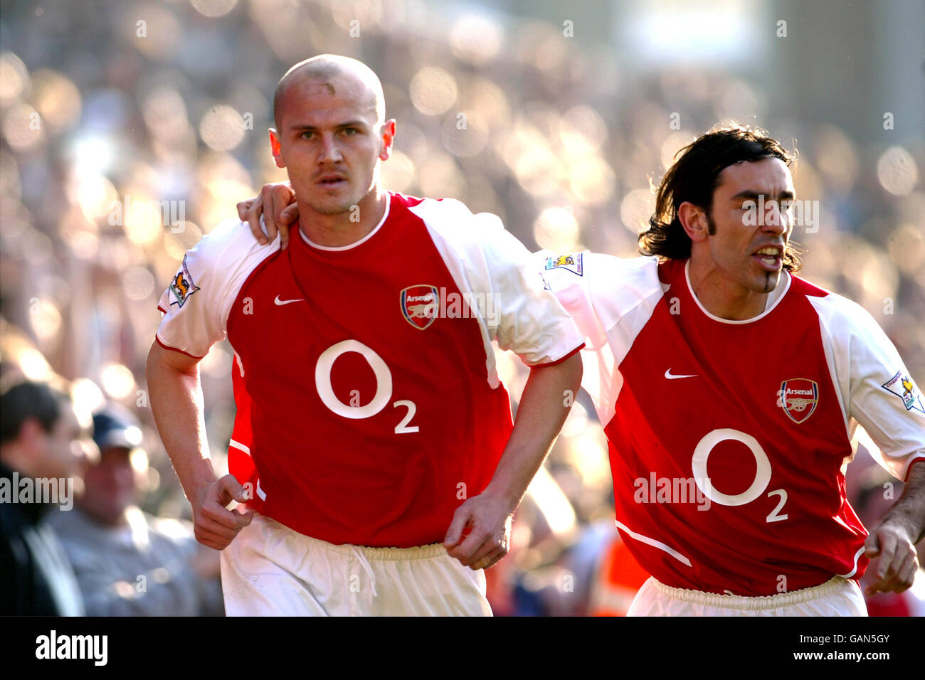 Arsenal's Pascal Cygan celebrates his goal with teammate Robert Pires ...