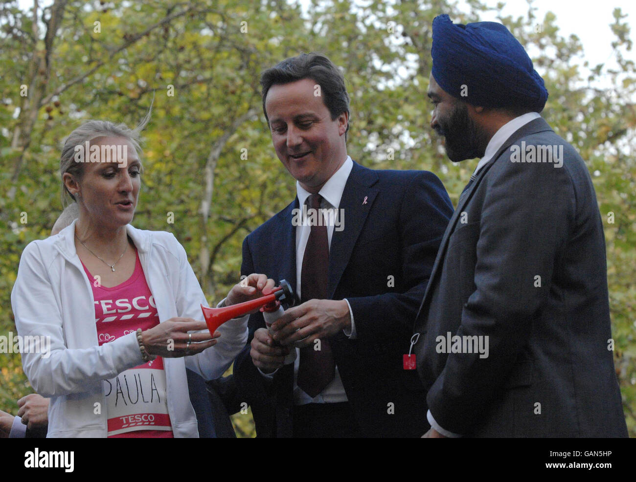 Conservative Party leader David Cameron (centre), runner Paula ...