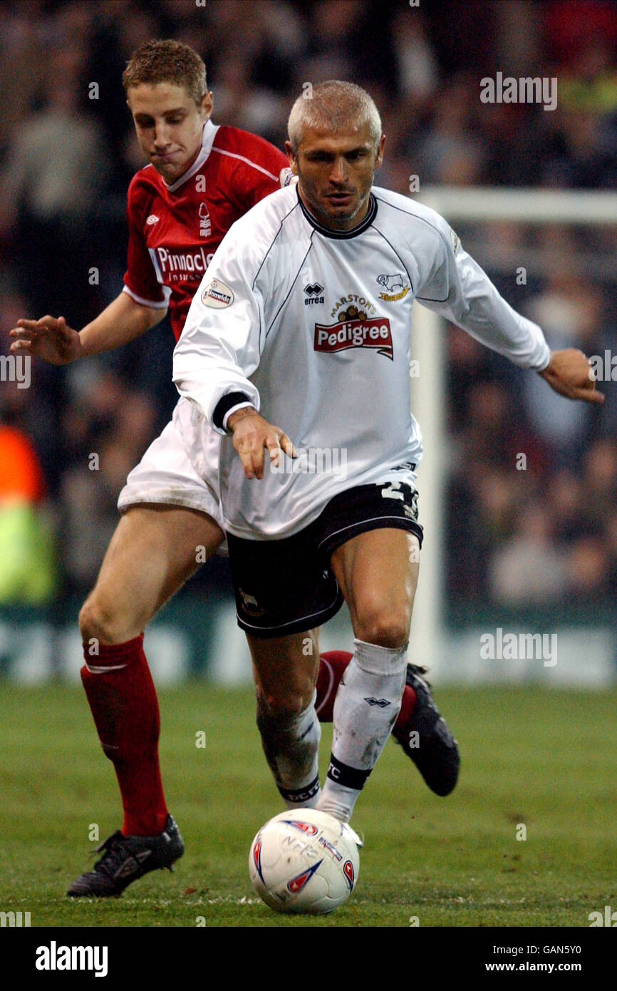 Derby County's Fabrizio Ravanelli (front) is shadowed by Nottingham ...