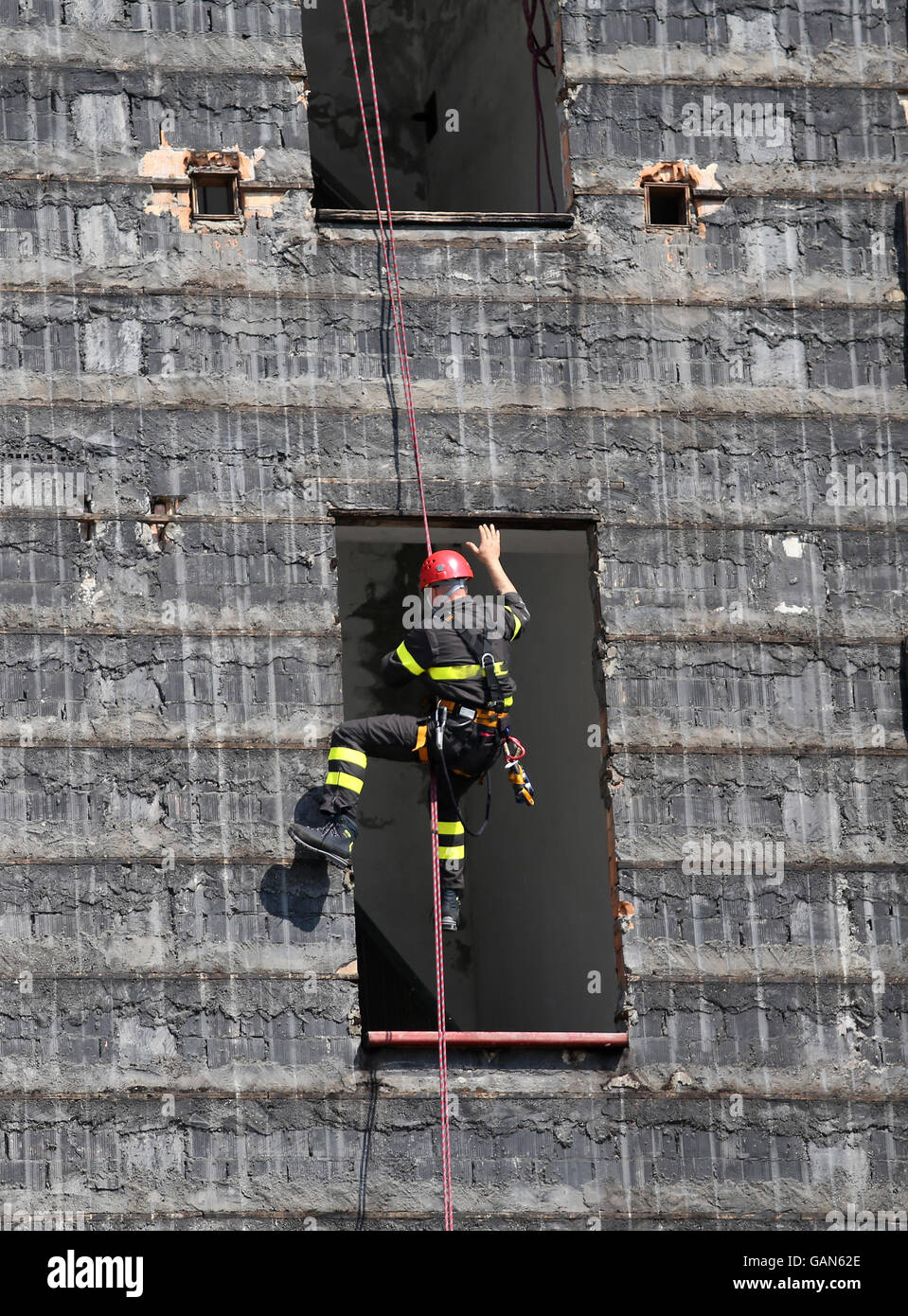 brave firefighters rappelling the wall during the fire drill Stock ...
