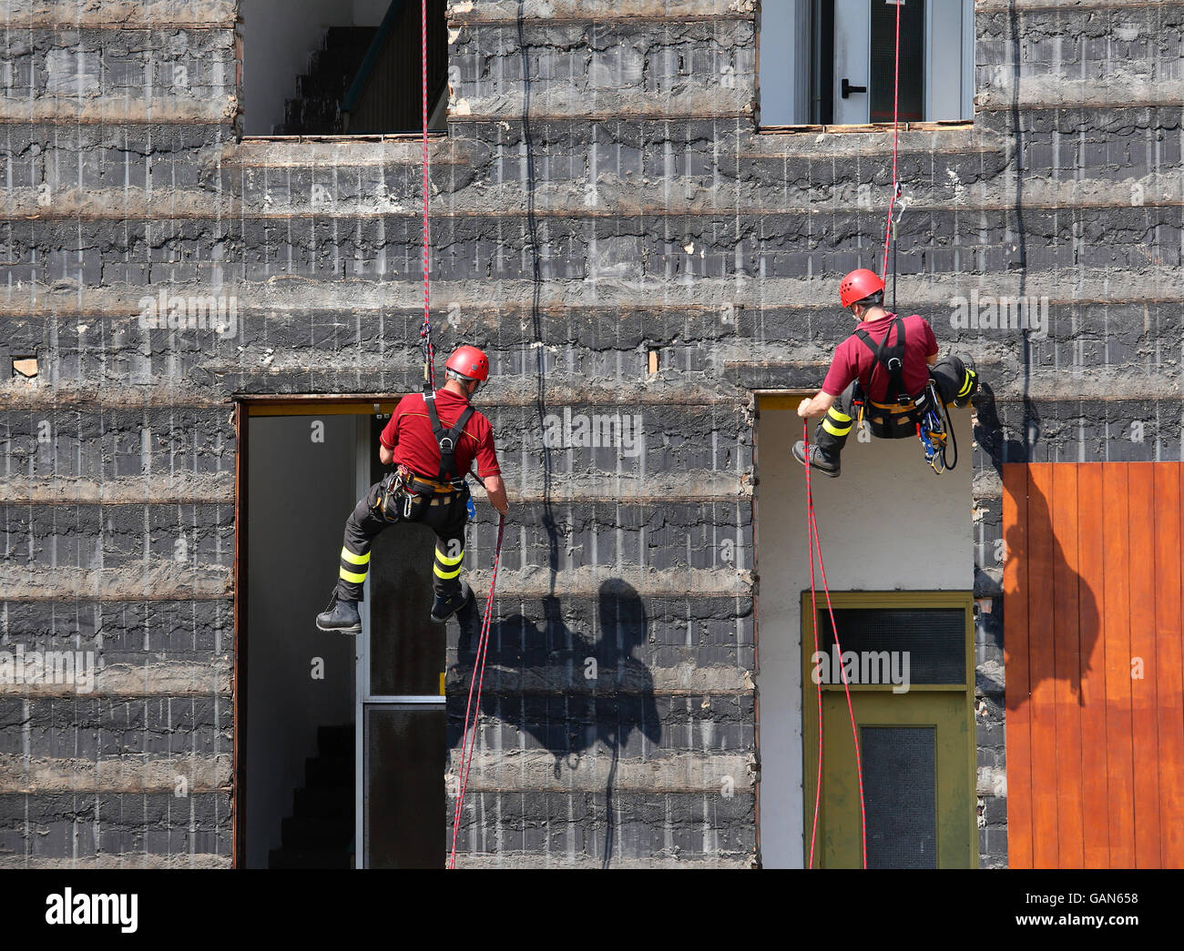 bold and daring climbers of firefighters climbing a wall Stock Photo ...