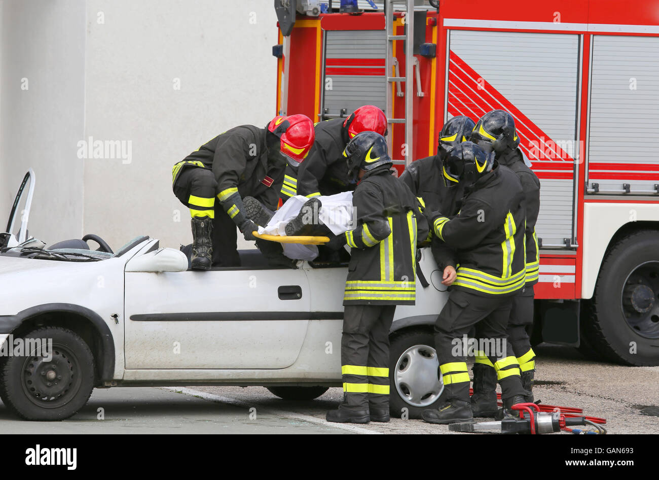 brave firefighters relieve an injured after car accident Stock Photo ...