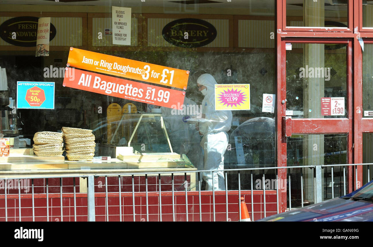 Police forensic officers work inside the Three Cooks bakery, in Burnt ...