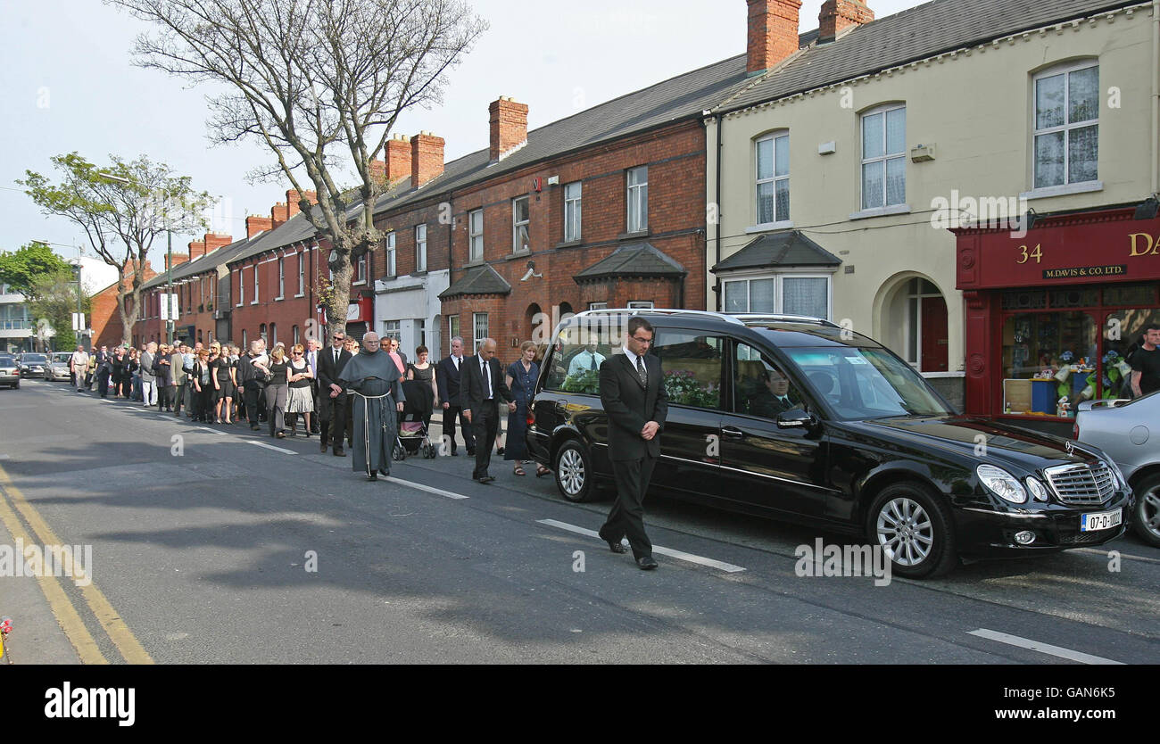Mourners attend the funeral removal service of Irish writer, journalist ...